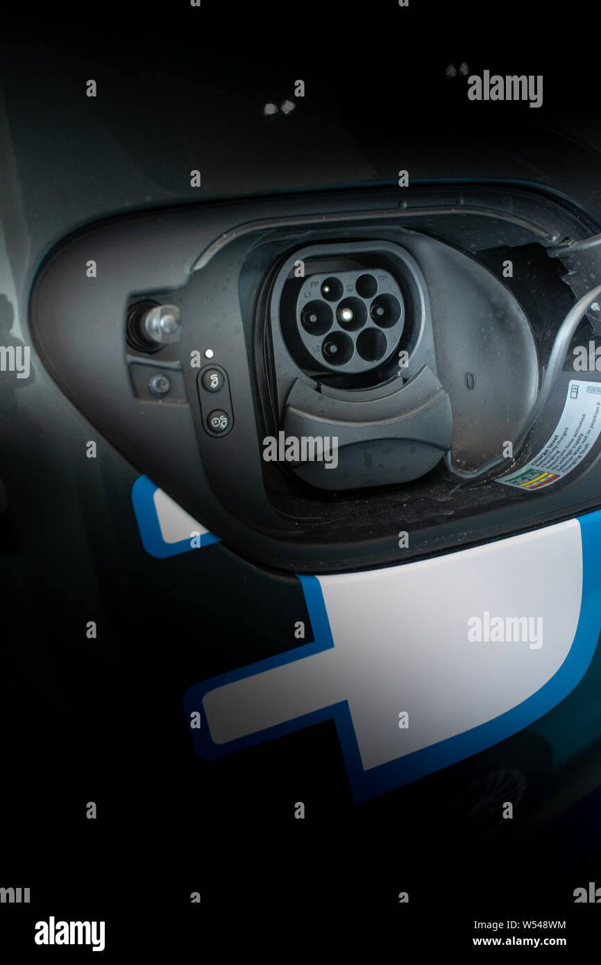 Electric recess on the side of a new electric car showing technical ...