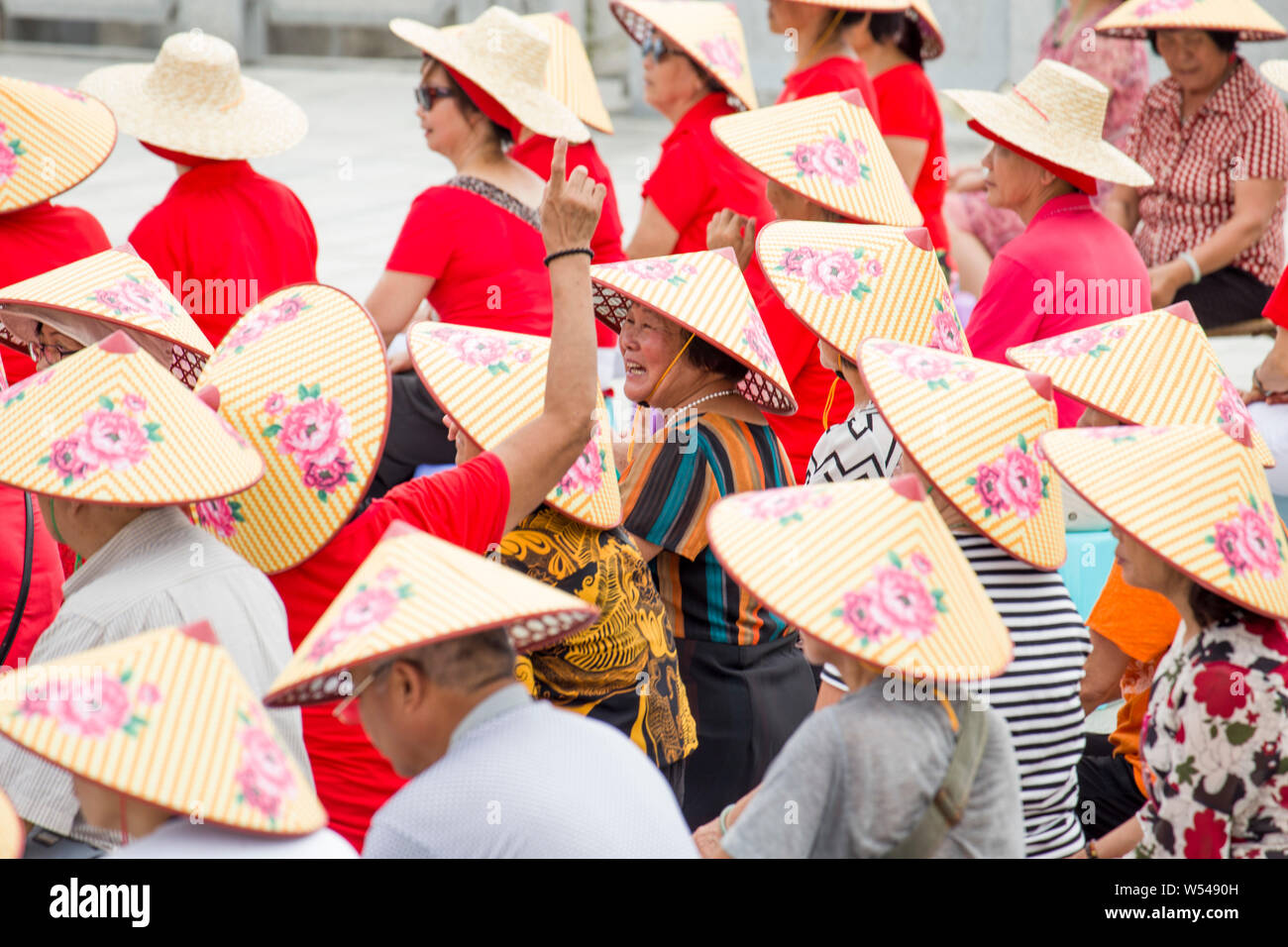 Elderly Chinese people visit a scenic spot in Hechun town, Zhanjiang ...