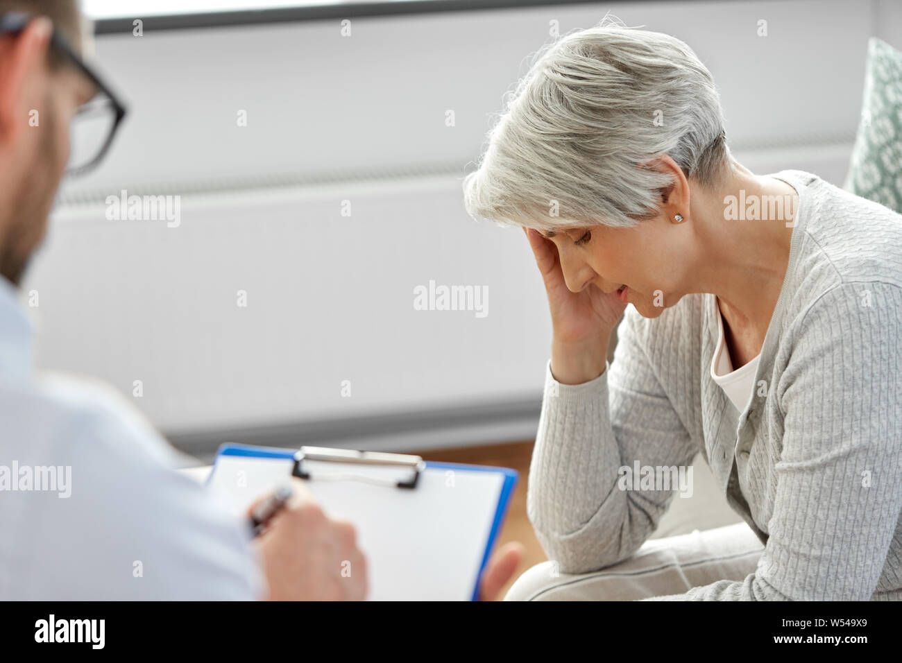 sad senior woman patient and psychologist Stock Photo - Alamy