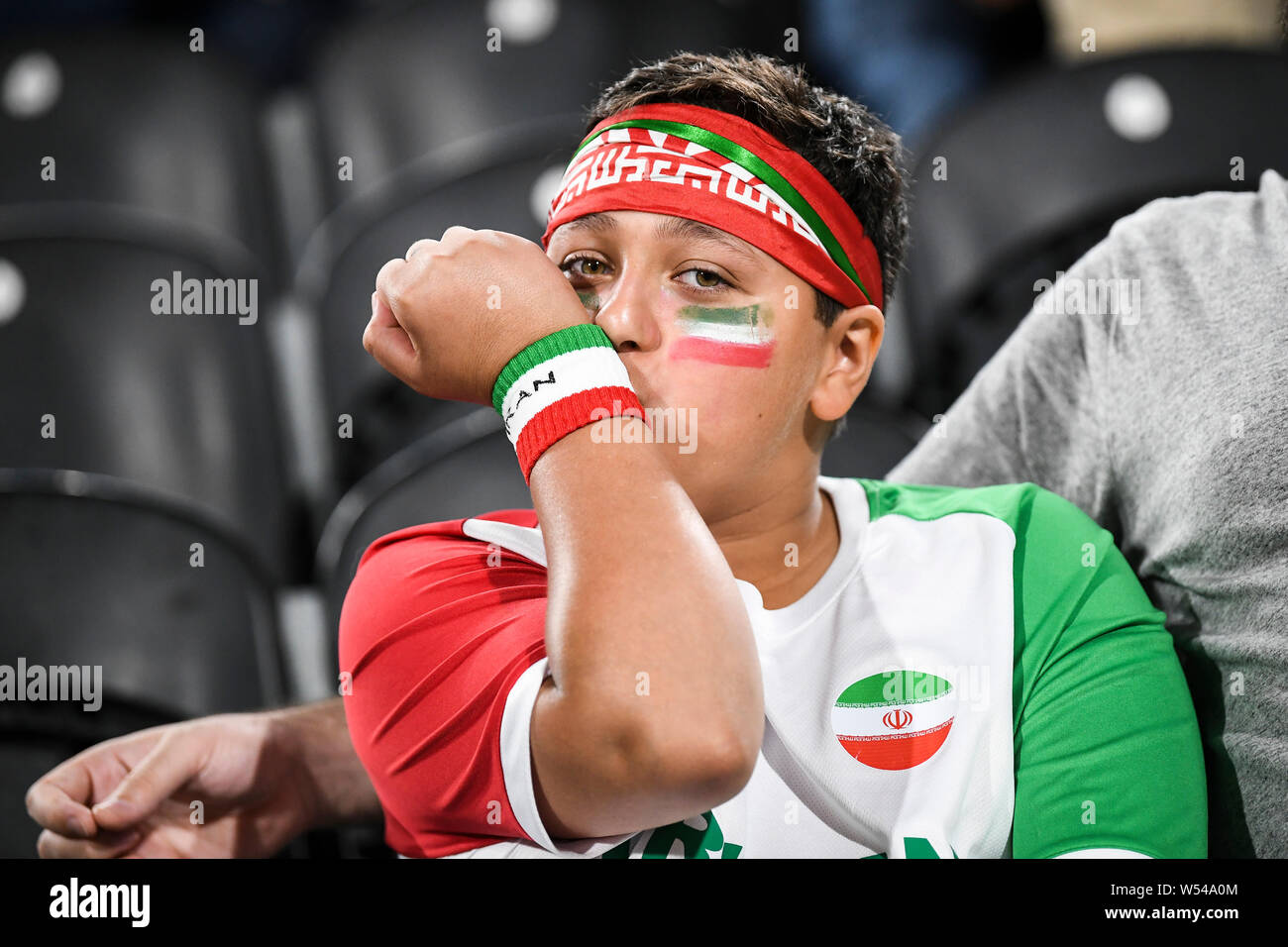 Iran fans wave slogans and national flags to show support to Iran ...