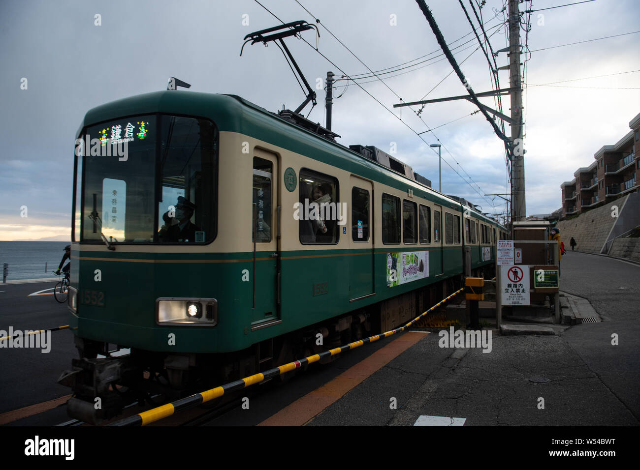 A train on the Enoden Line enters the Kamakura-Koko-Mae Station by the ...