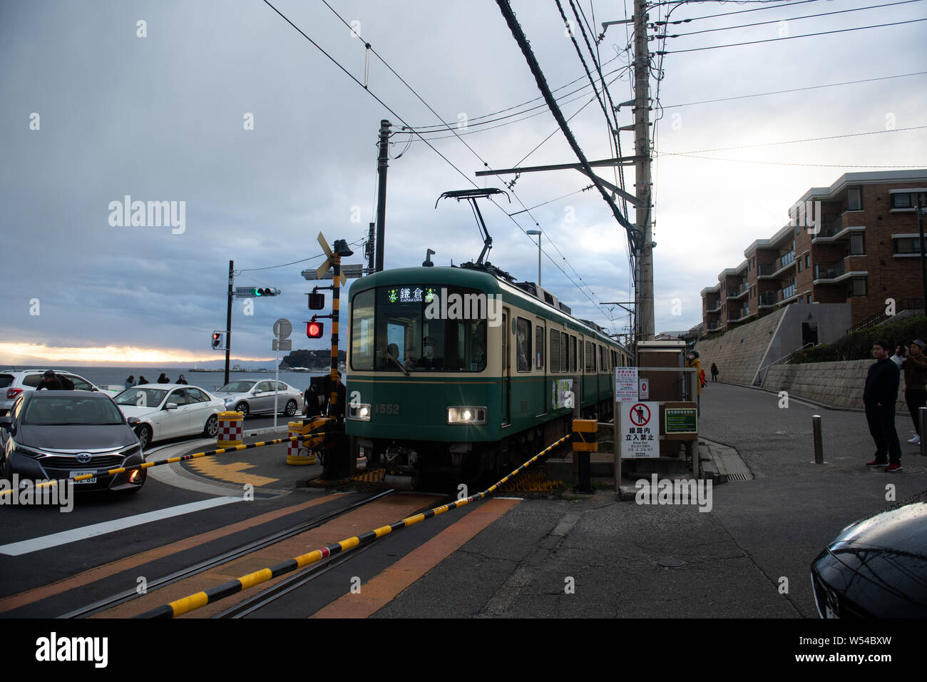A train on the Enoden Line enters the Kamakura-Koko-Mae Station by the ...