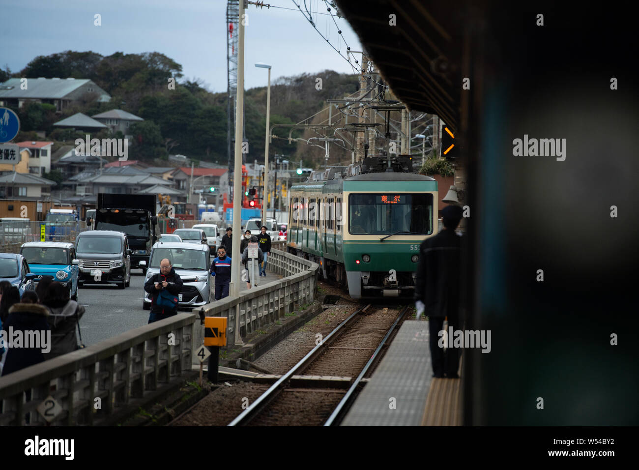 A train on the Enoden Line enters the Kamakura-Koko-Mae Station by the ...