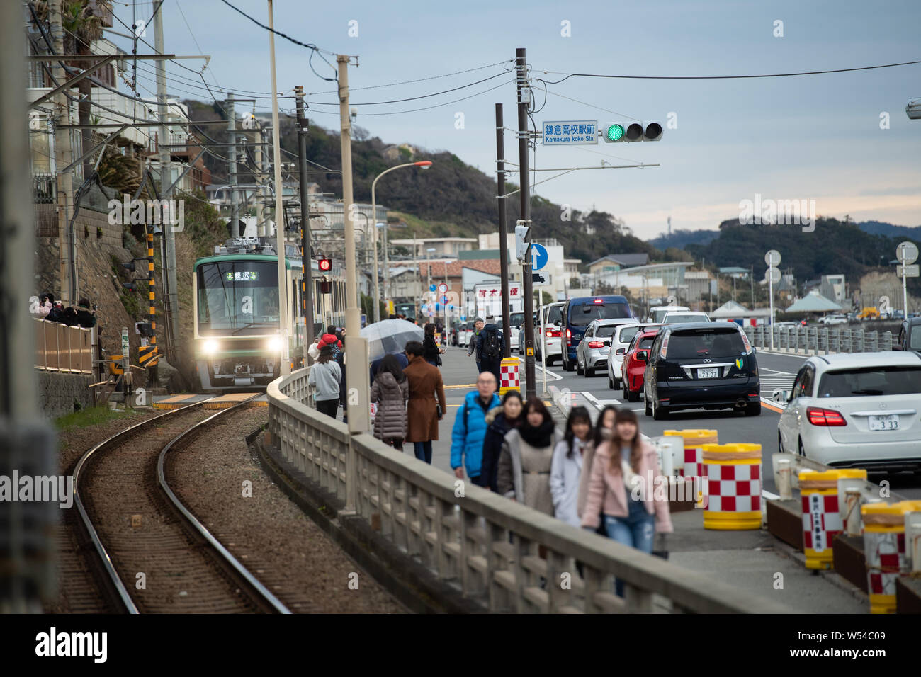 A train on the Enoden Line enters the Kamakura-Koko-Mae Station by the ...