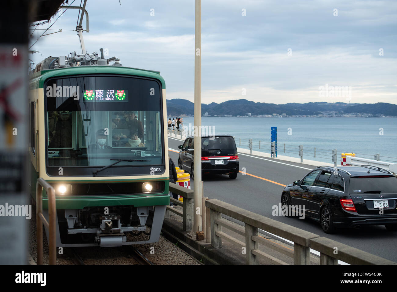 A train on the Enoden Line enters the Kamakura-Koko-Mae Station by the ...