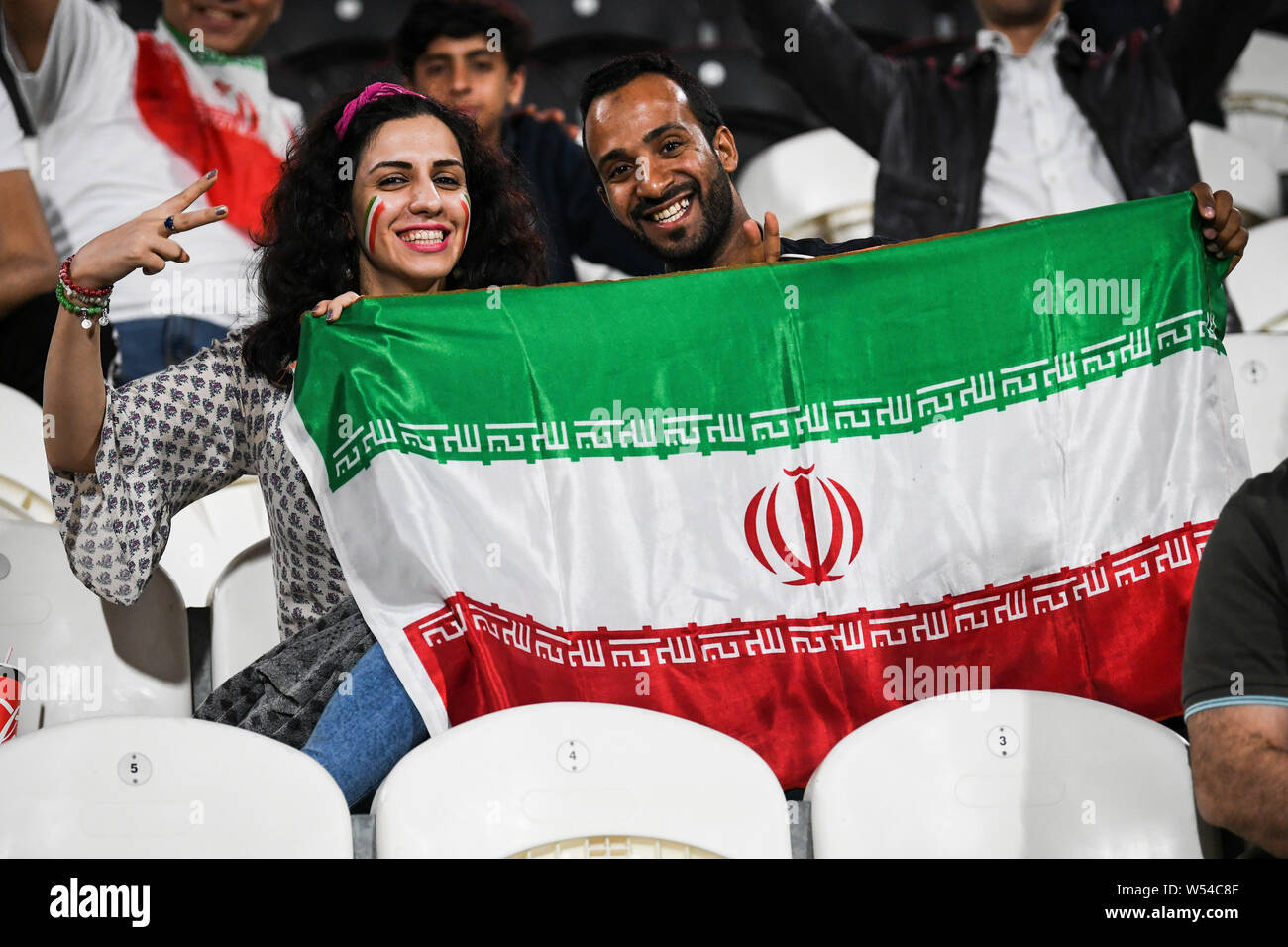 Iran fans wave slogans and national flags to show support to Iran ...