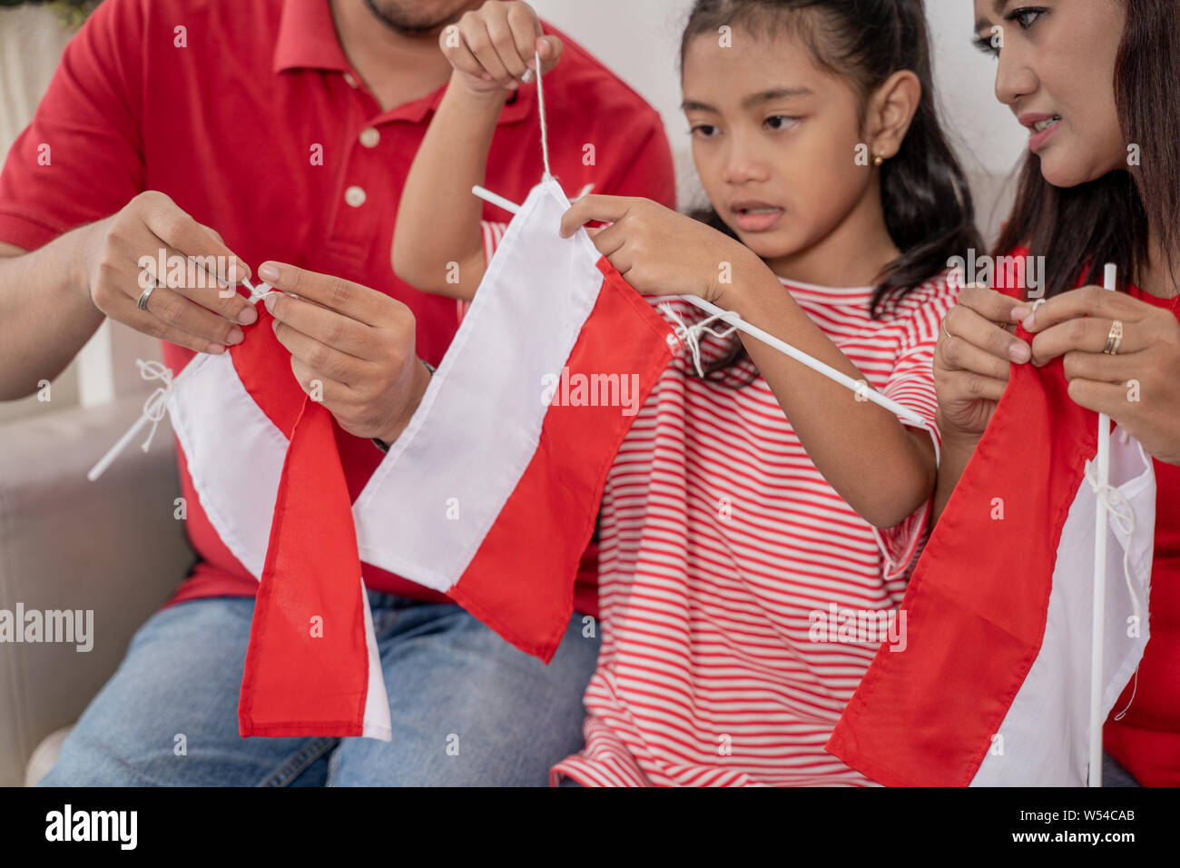 parent with daughter preparing and make their own indonesian flag Stock ...