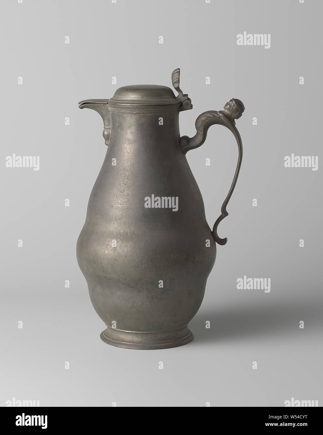Tin jug with lid, Tin jug. The pear-shaped body rests on the stand ring ...