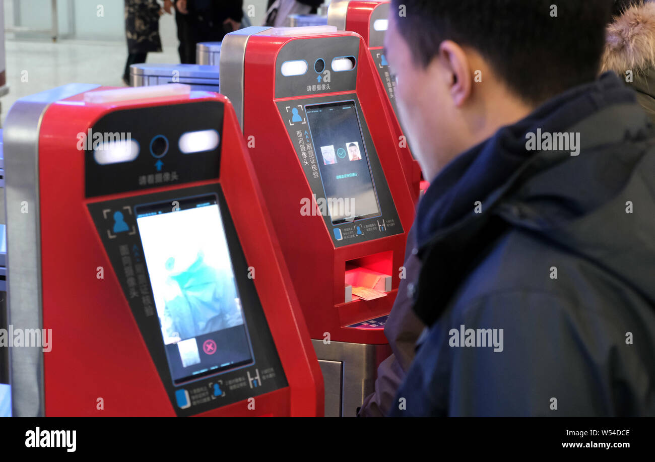 Passengers use face recognition system and their identity cards to ...