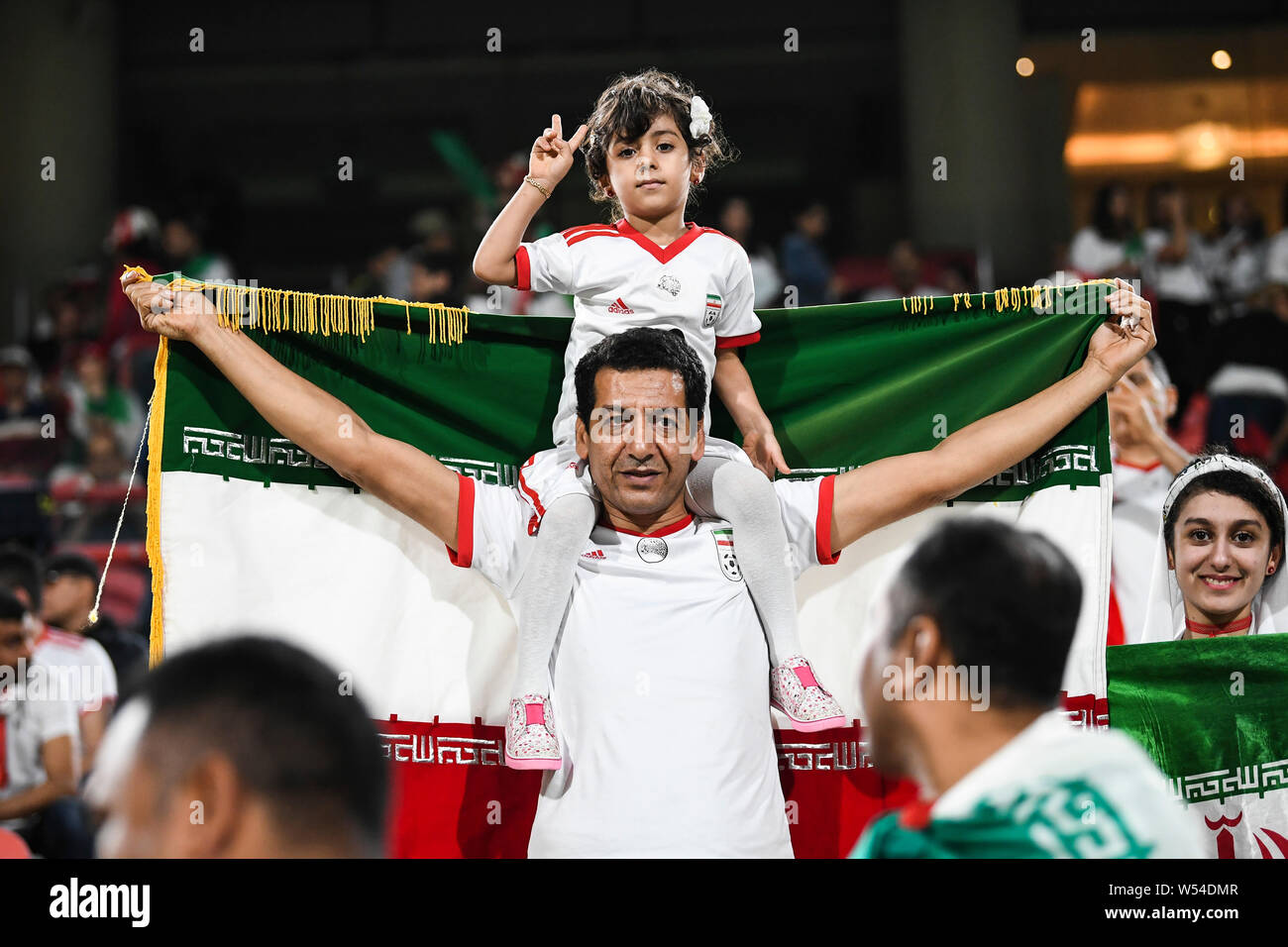 Iran fans wave slogans and national flags to show support to Iran ...