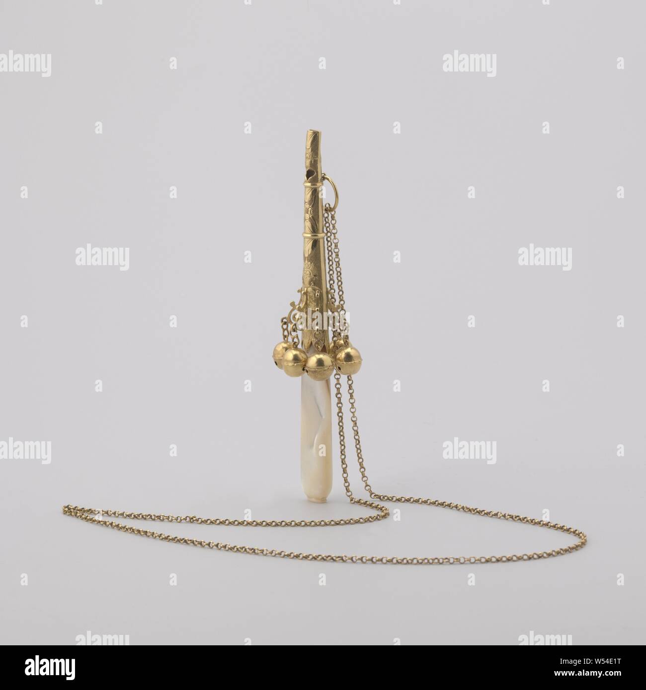 Rattle with mother-of-pearl biting piece, The golden rattle has a ...