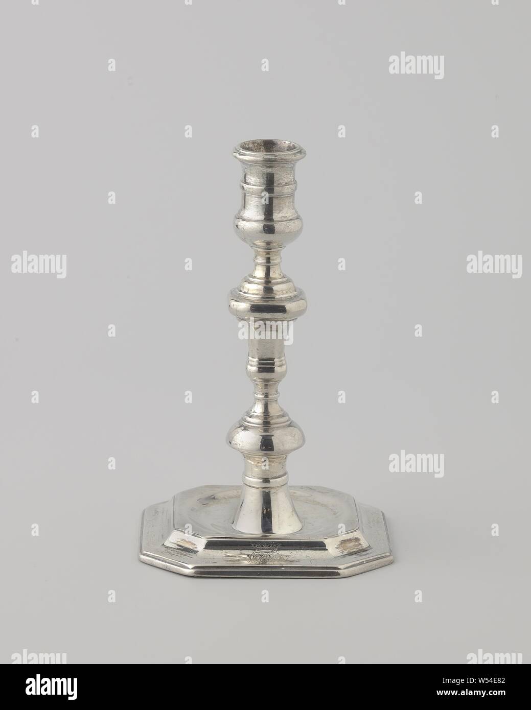 Candlestick with an engraved alliance weapon on its foot consisting of ...