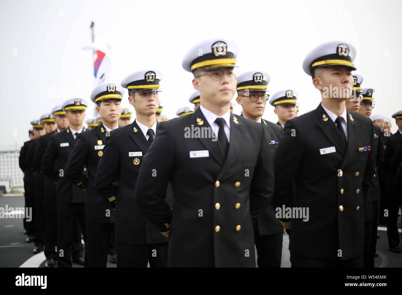 South Korean naval soldiers pose after arriving at a military port in ...