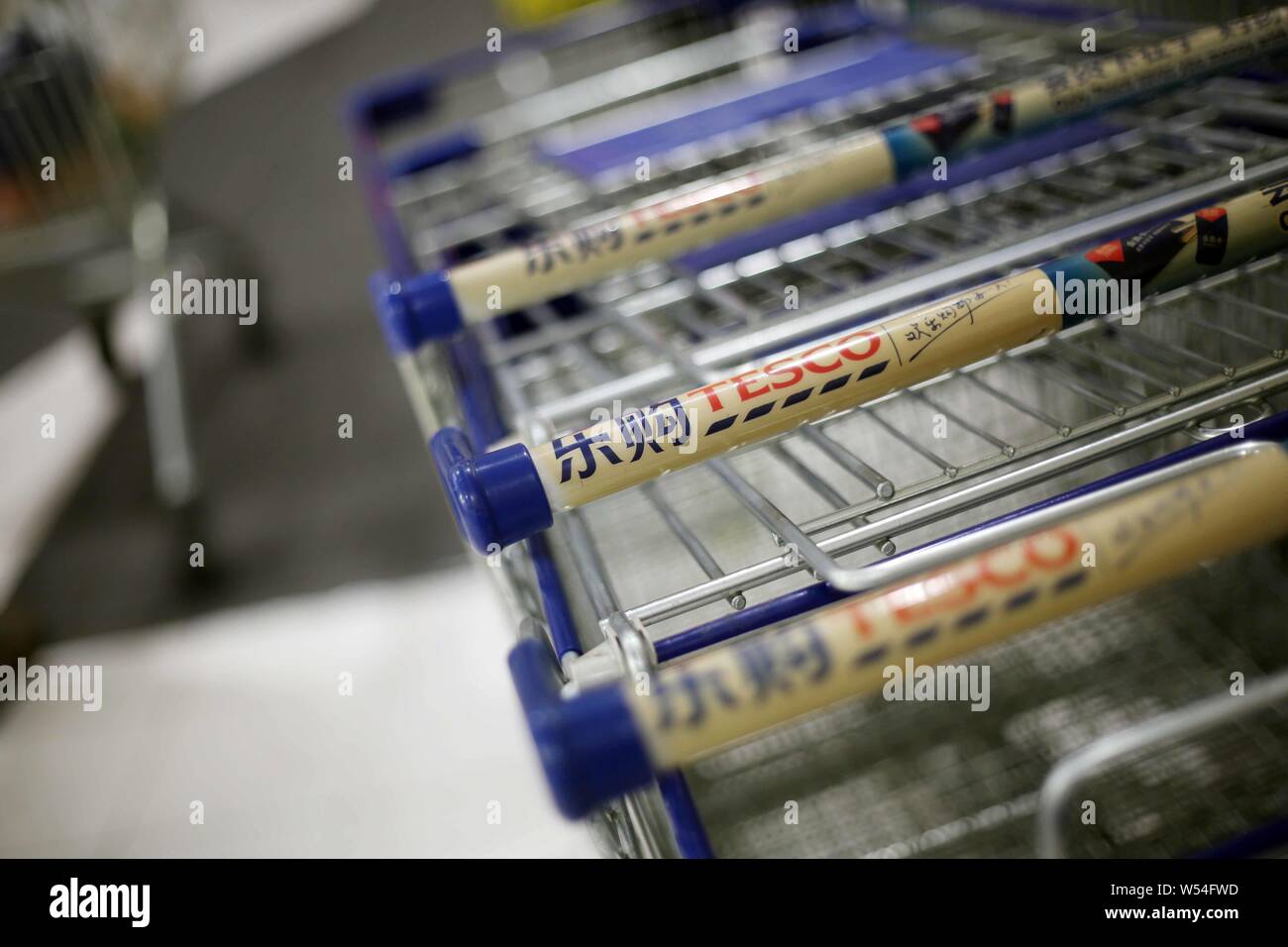 --FILE--Shopping carts are on display at a supermarket of Tesco, the ...
