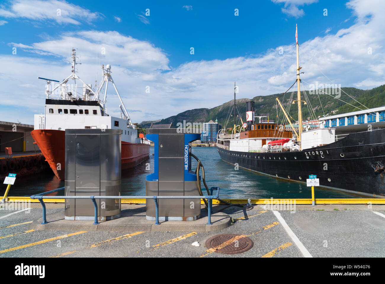 BERGEN, NORWAY - JULY 28, 2018: Ships moored at the port of Bergen. The ...