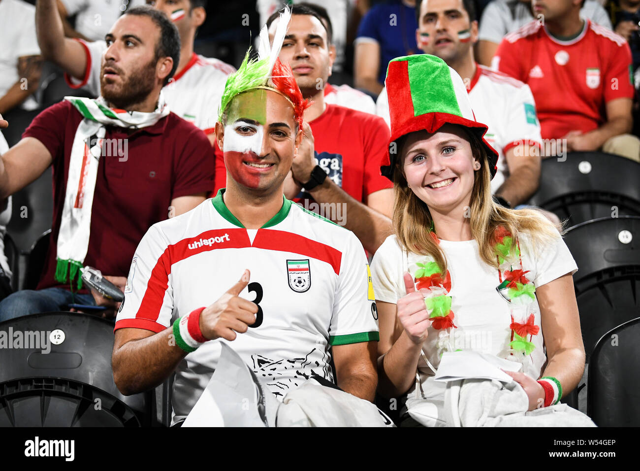 Iran fans wave slogans and national flags to show support to Iran ...