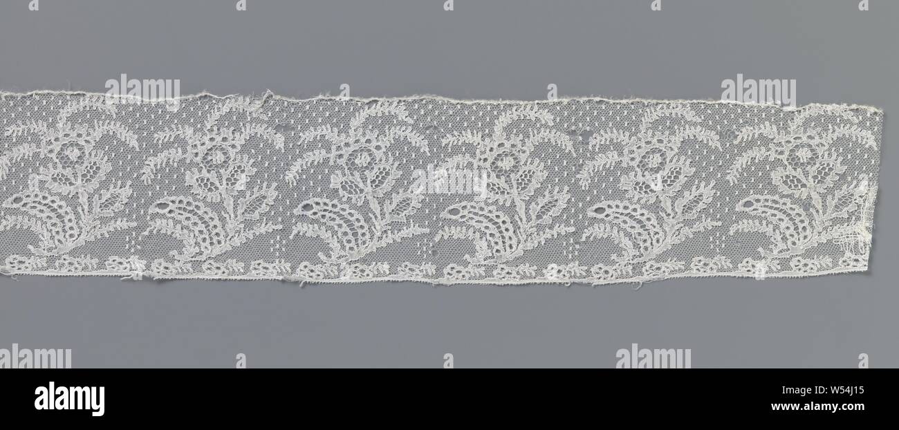Strip of bobbin lace with calyx from which four narrow feathered plumes ...