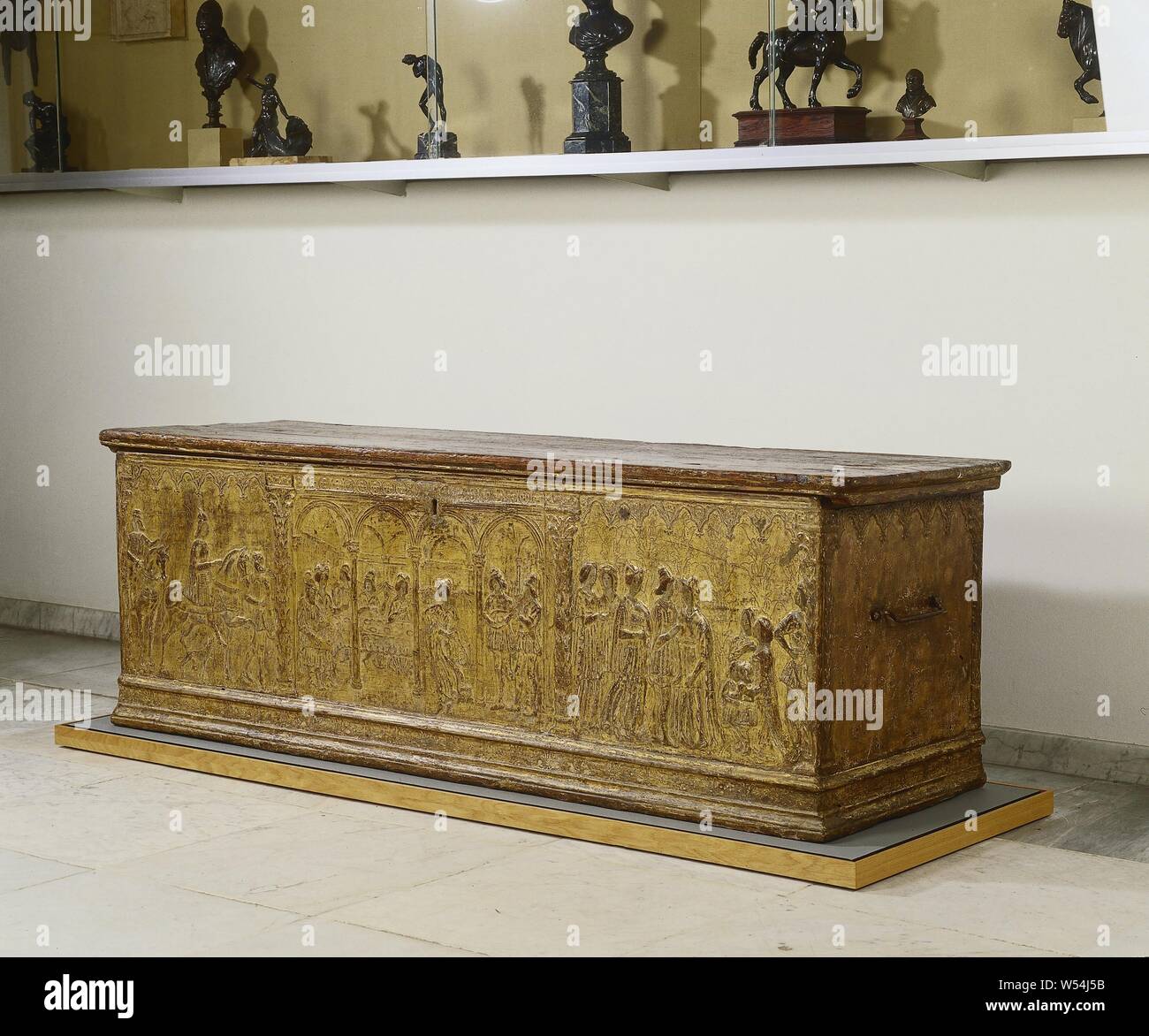 Gilded poplar wood chest, front plate decorated with reliefs in stucco ...