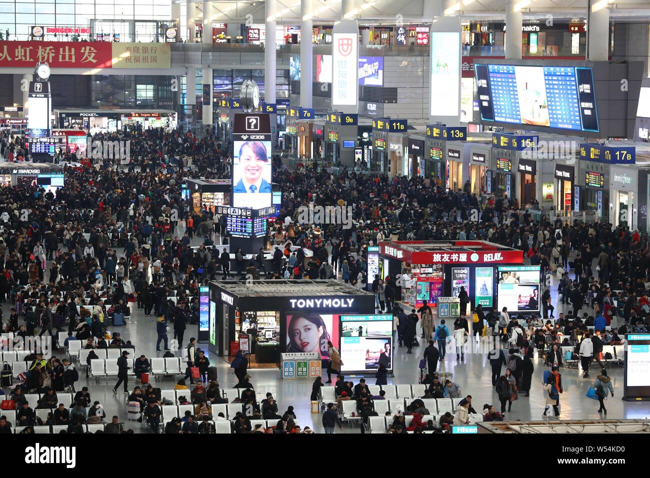 Passengers wait for their trains during the Spring Festival travel rush ...