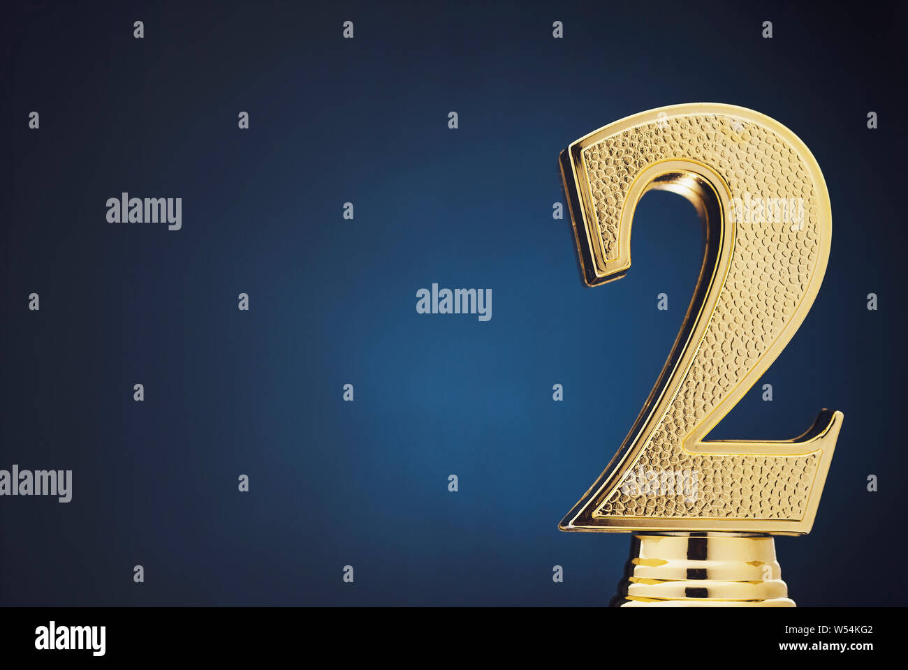 Second place winners gold trophy with a 3D textured metallic number two ...