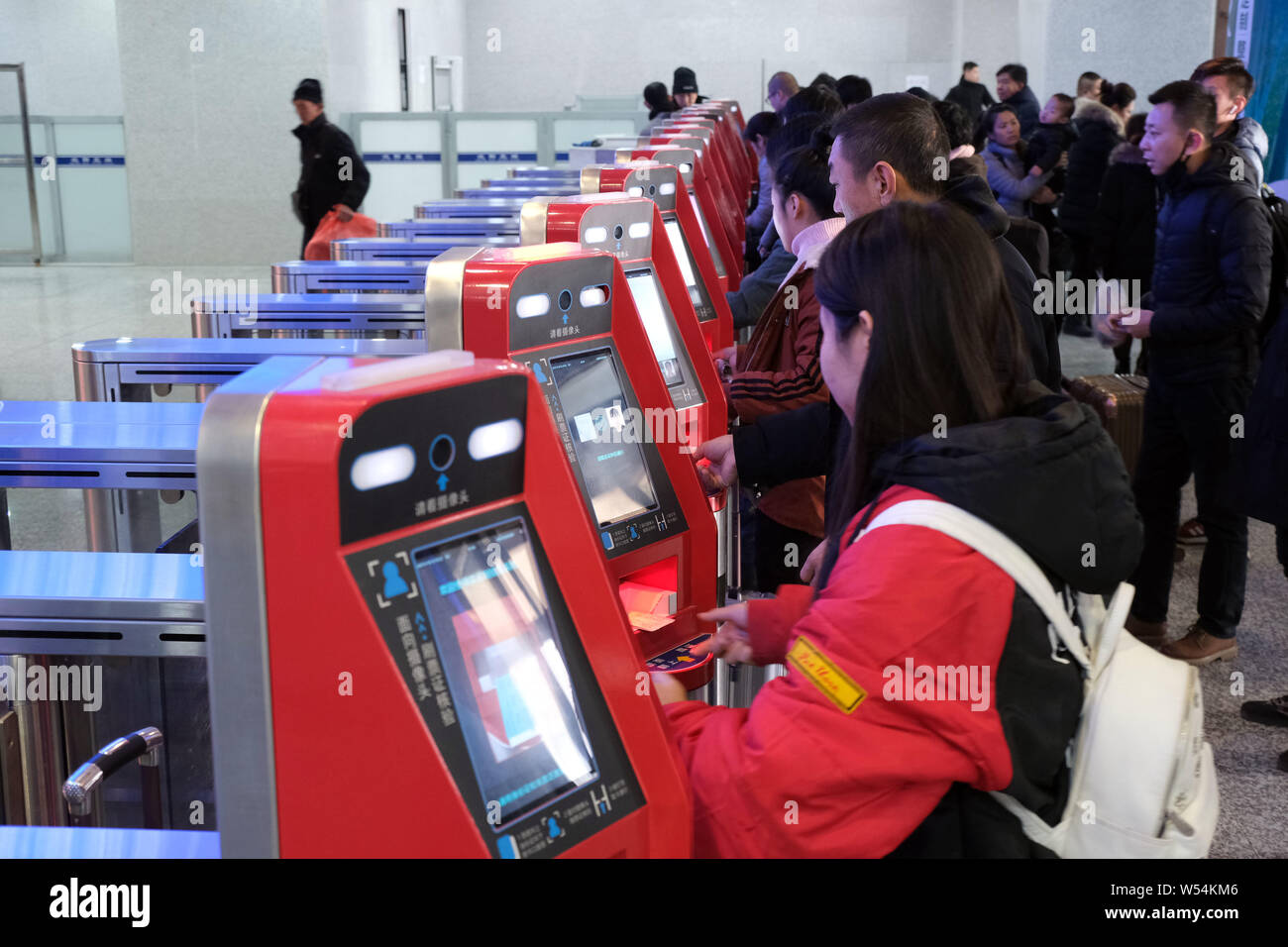 Passengers use face recognition system and their identity cards to ...