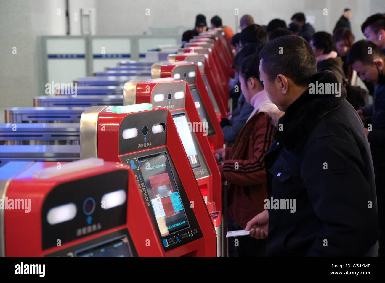 Passengers use face recognition system and their identity cards to ...