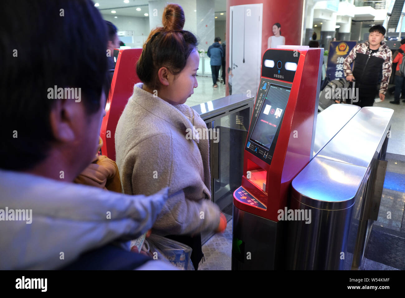 Passengers use face recognition system and their identity cards to ...