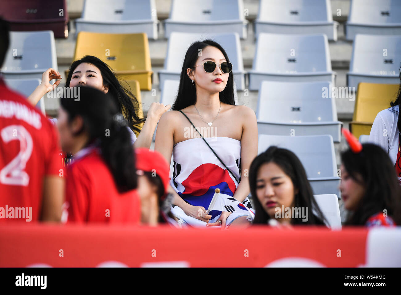 A South Korean football fan wearing the national flag shows support for ...
