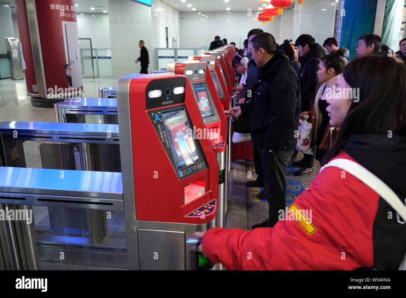 Passengers use face recognition system and their identity cards to ...