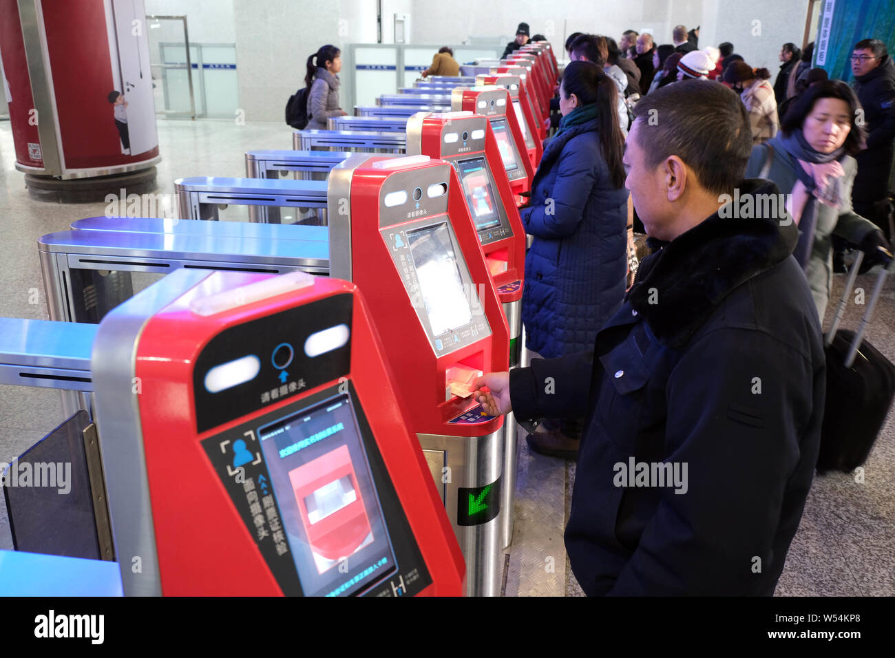 Passengers use face recognition system and their identity cards to ...