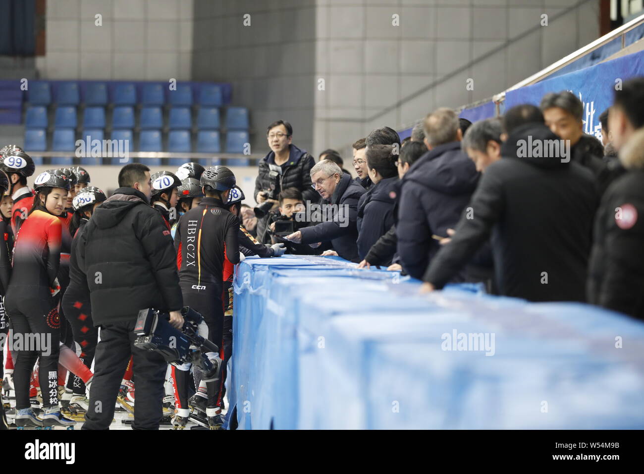 Thomas Bach, center, President of the International Olympic Committee ...