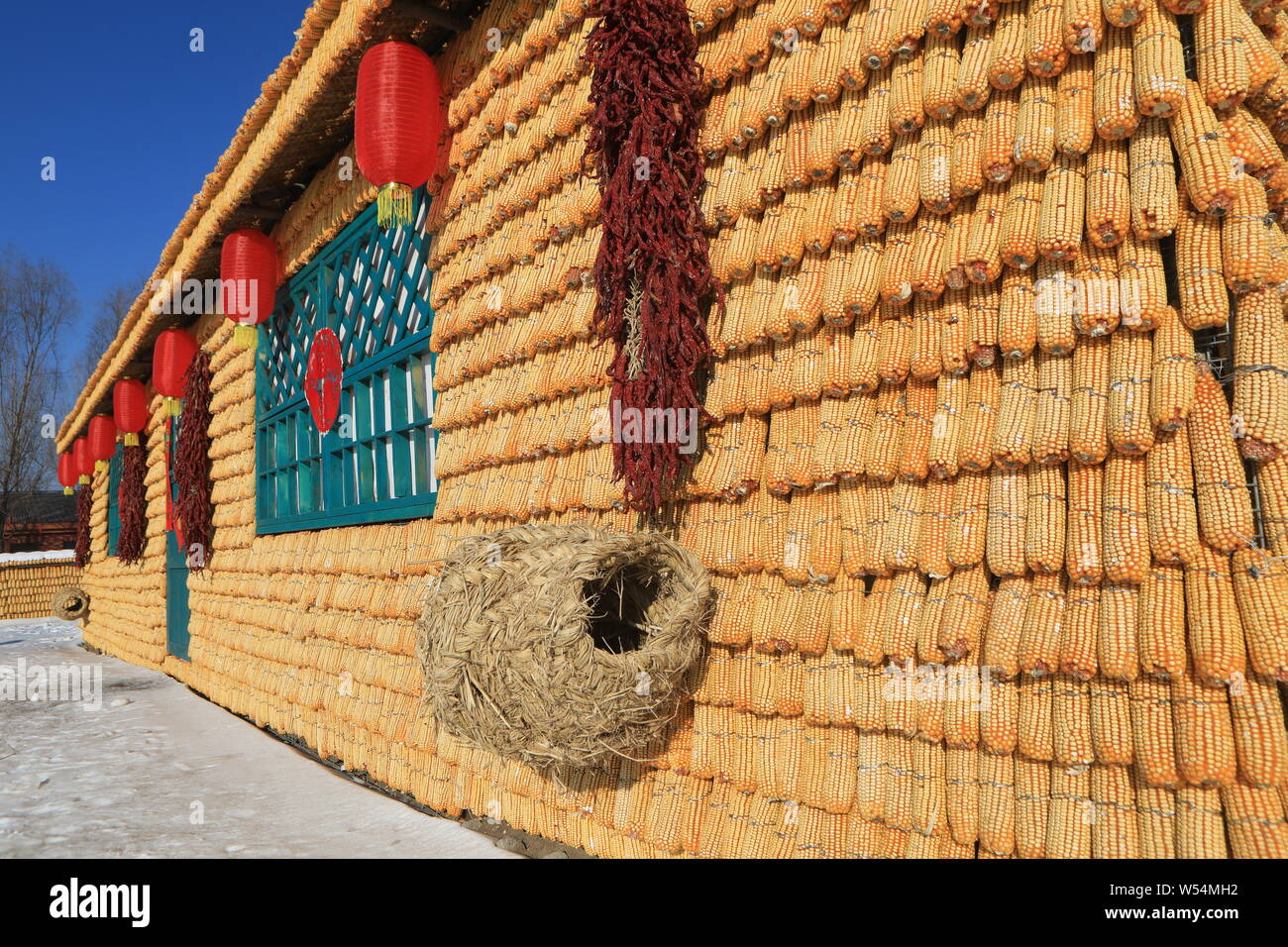 View of a traditional village house built by 30,000 corn cobs in ...