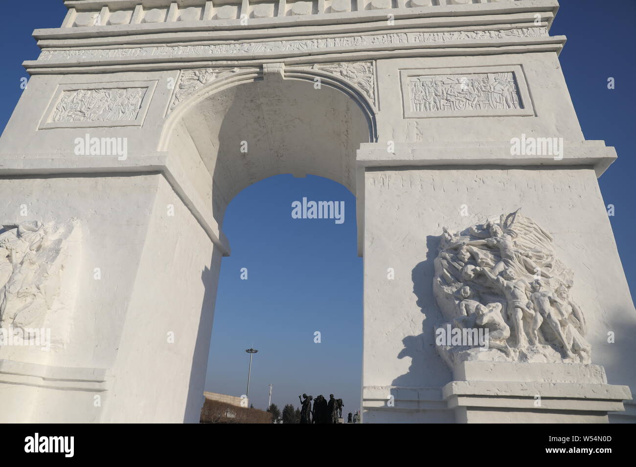 A snow sculpture of the Arc de Triomphe is on display at the Changchun ...