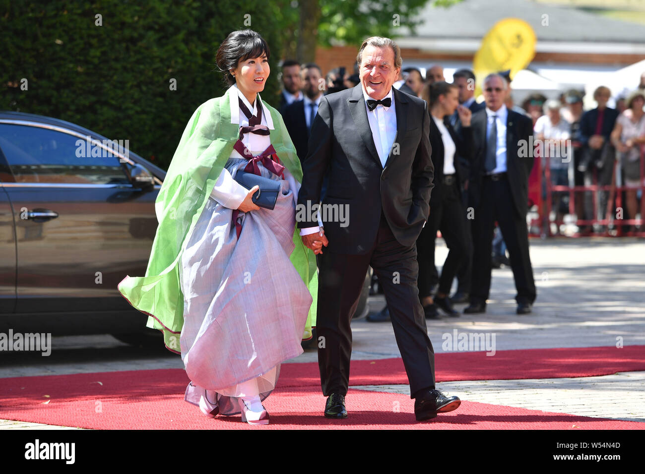 Old Federal Chancellor Gerhard SCHROEDER (SPD) with wife So Yean KIM on their arrival. Opening ...