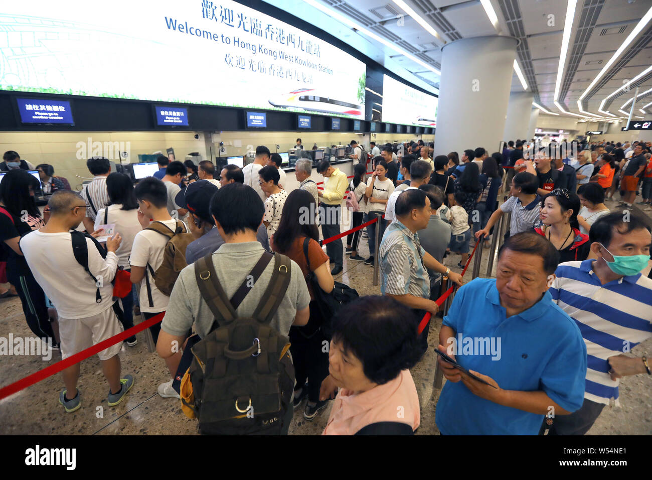 --FILE--Visitors from Chinese mainland queue up at the West Kowloon ...