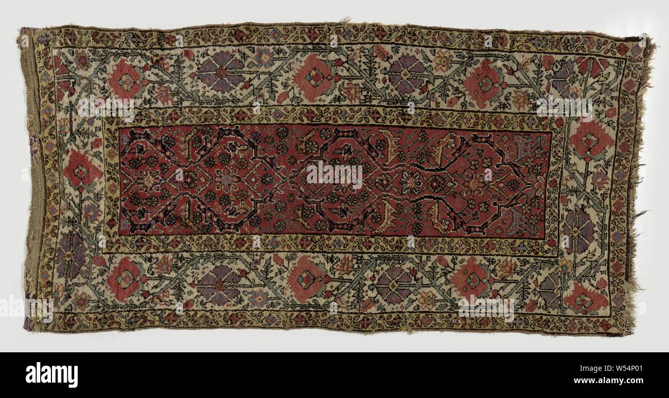 Eastern carpet, the midfield of which is decorated with arabesques ...