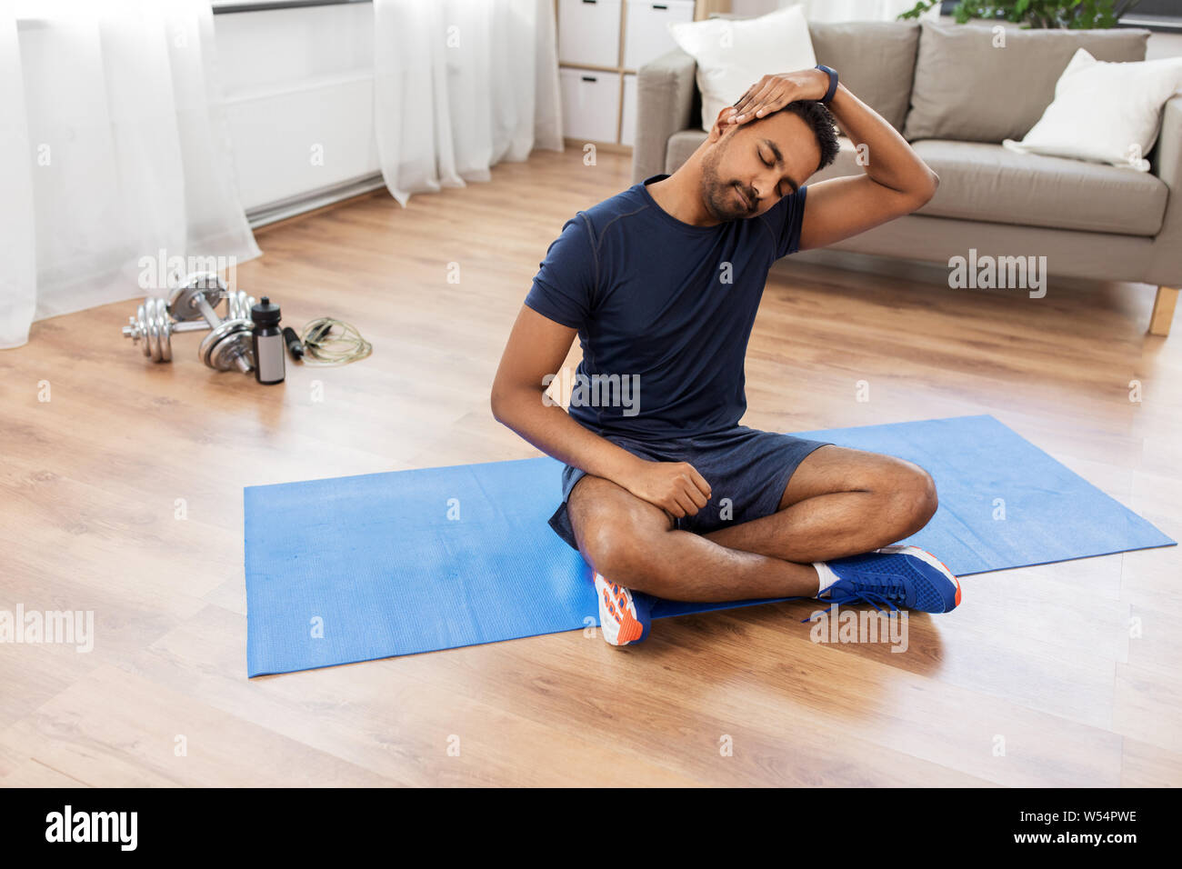 man training and stretching body at home Stock Photo - Alamy