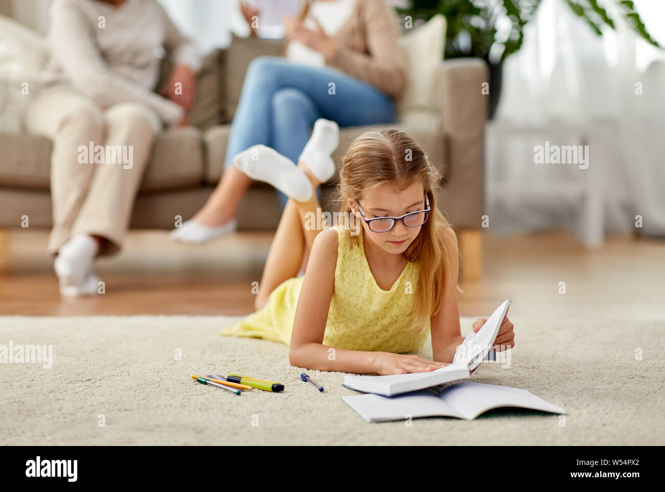 student girl with textbook learning at home Stock Photo - Alamy