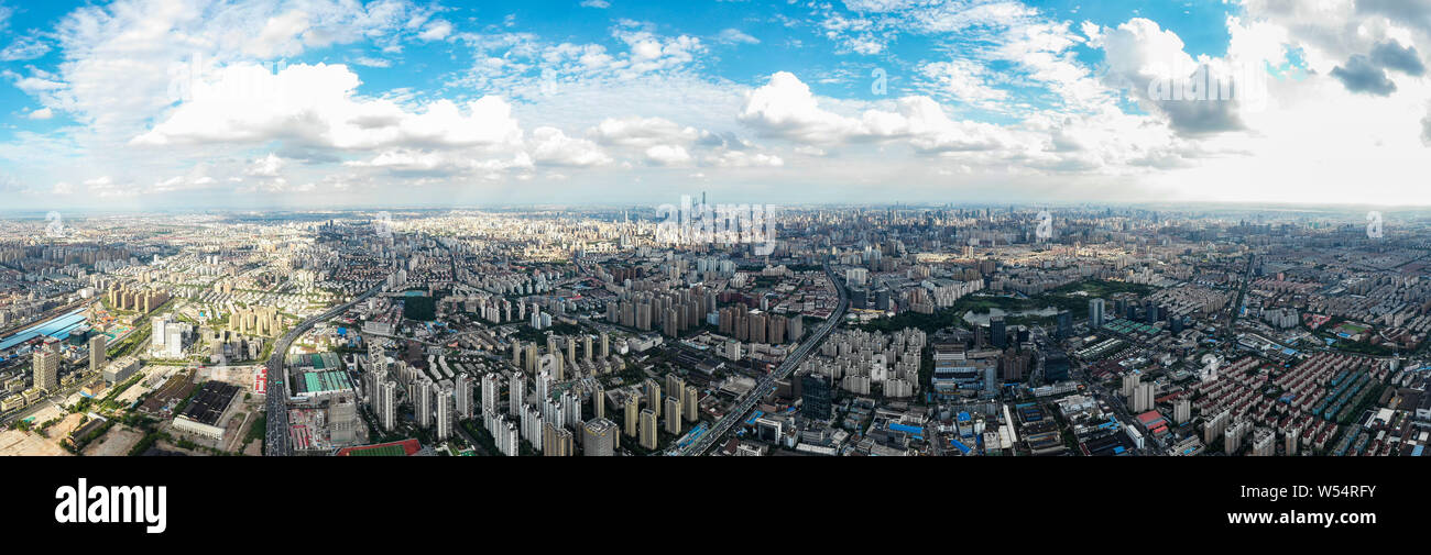 A panoramic view of Puxi area with clusters of houses and buildings in ...