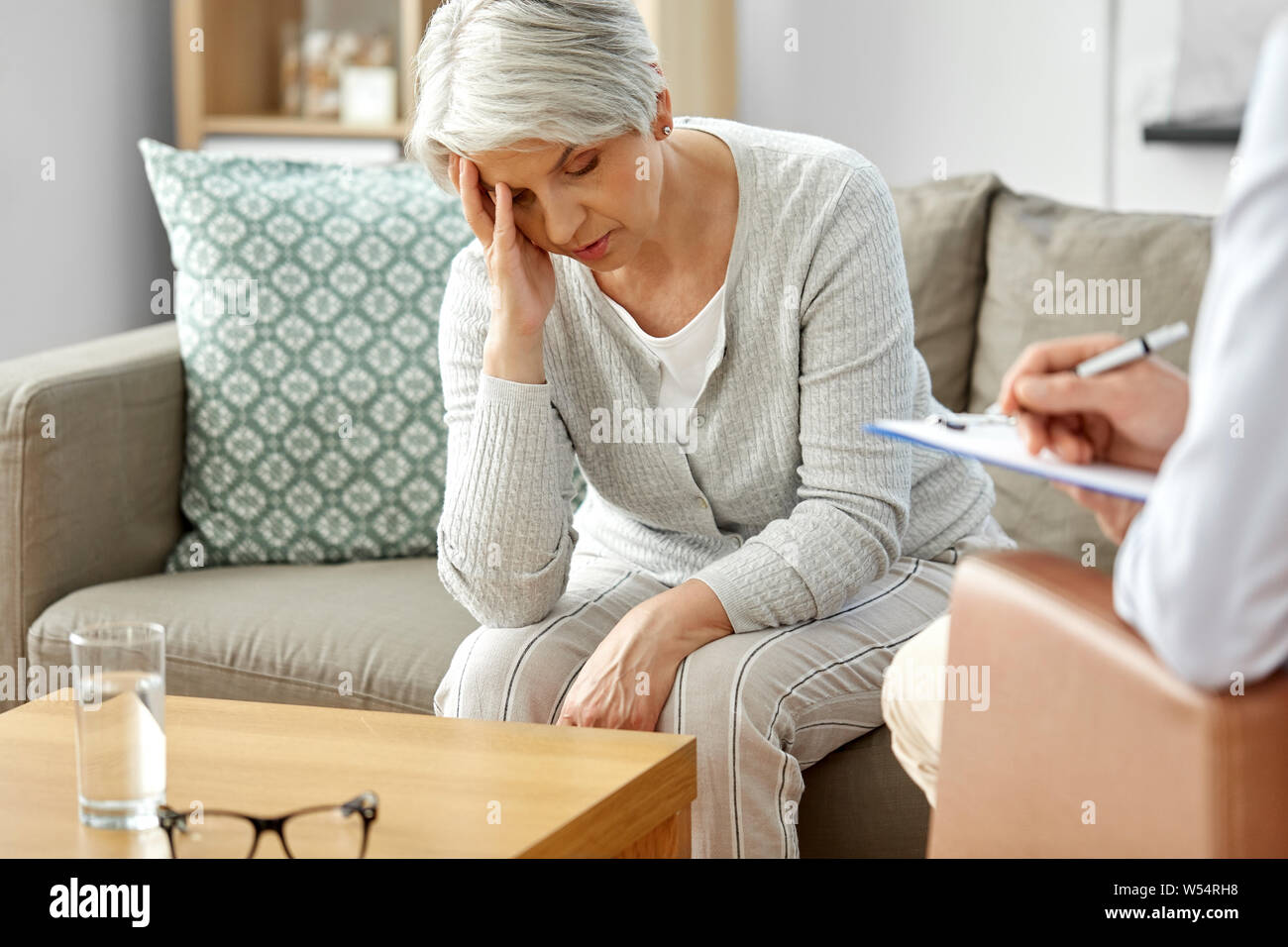 sad senior woman patient and psychologist Stock Photo - Alamy