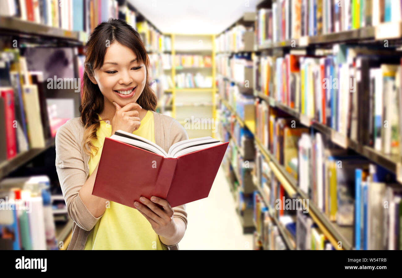 happy asian woman reading book Stock Photo - Alamy