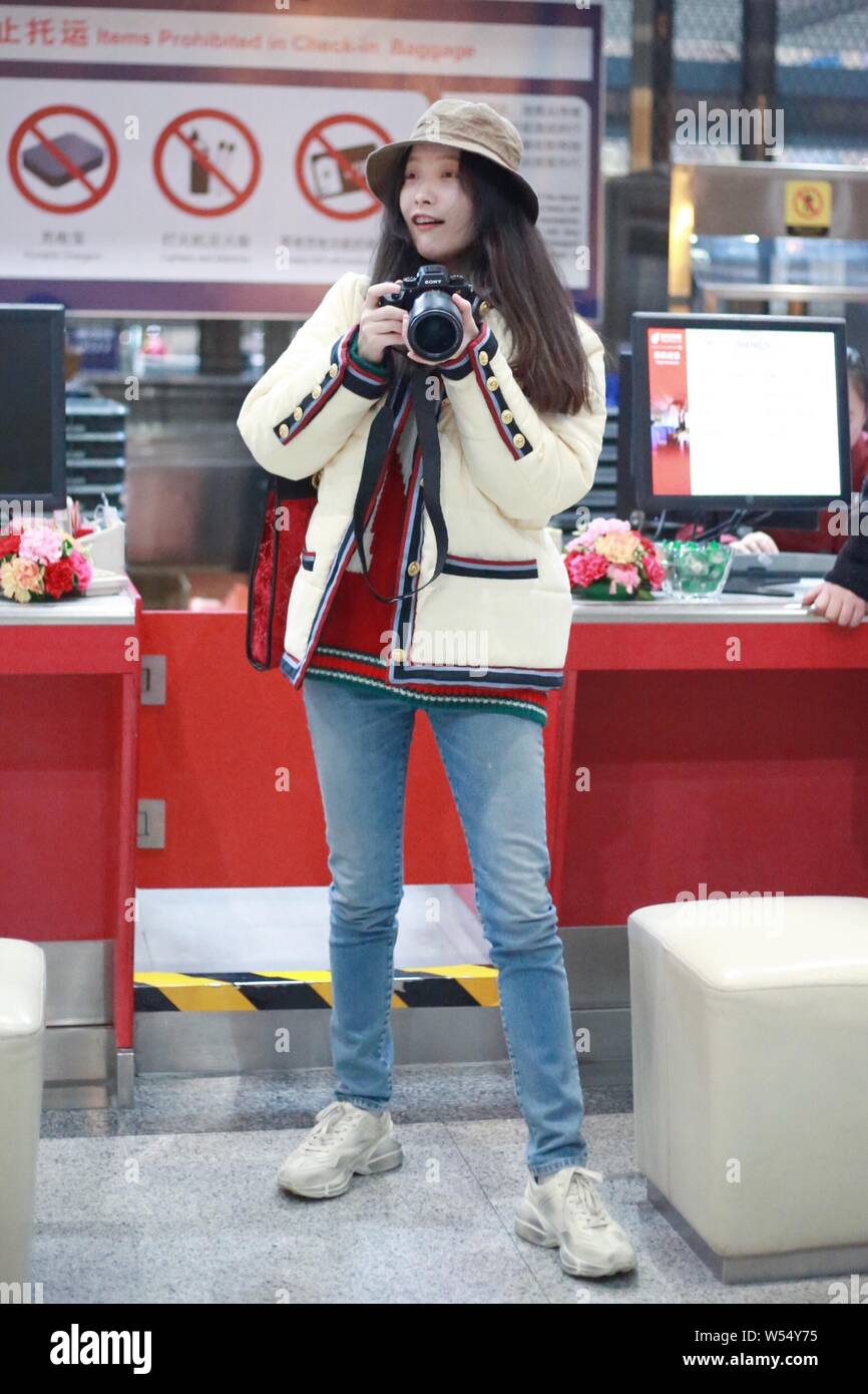 Chinese actress Ni Ni arrives at the Beijing Capital International ...
