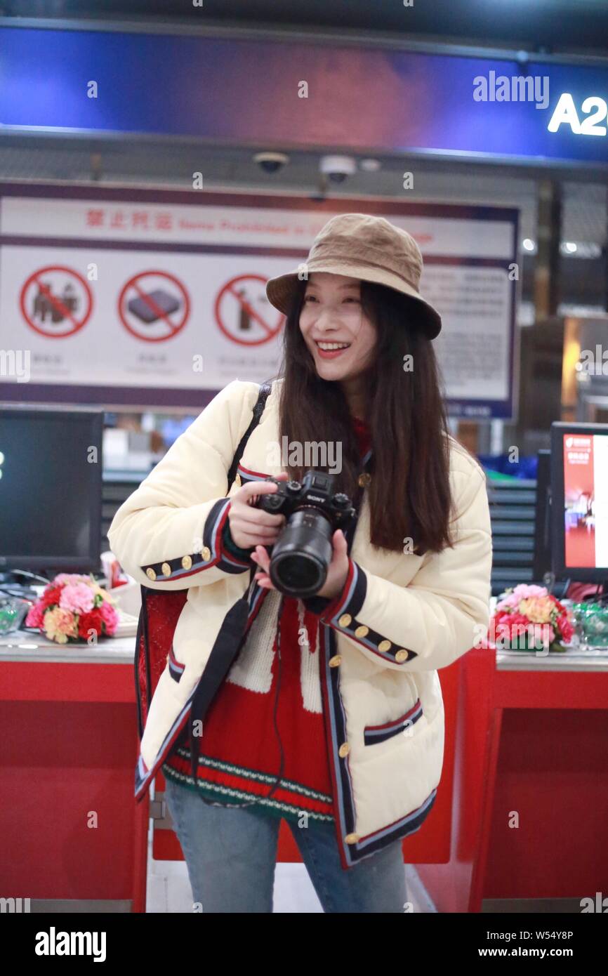 Chinese actress Ni Ni arrives at the Beijing Capital International ...