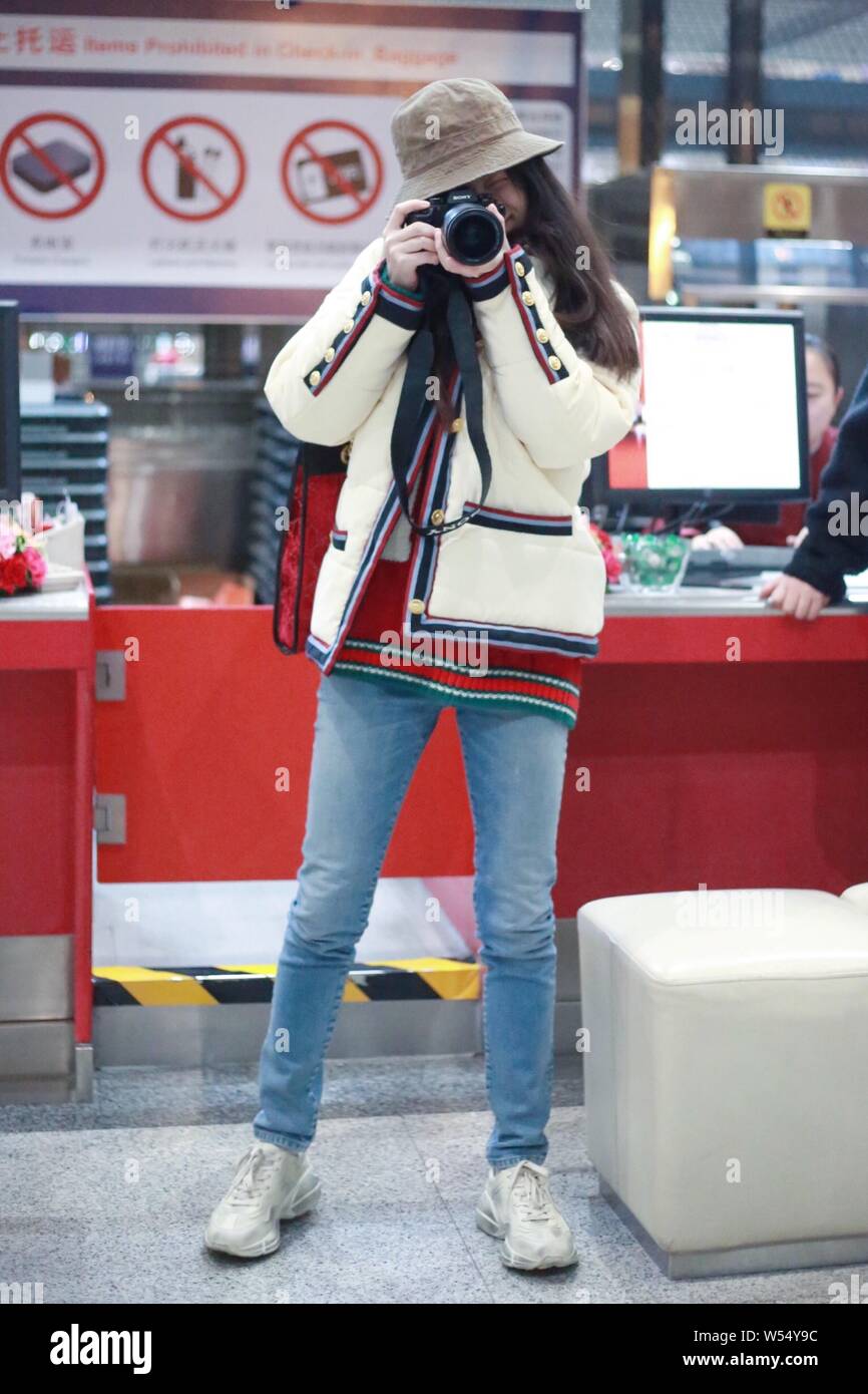 Chinese actress Ni Ni arrives at the Beijing Capital International ...