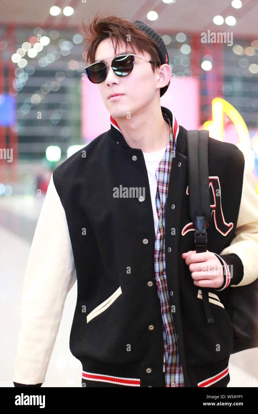 Chinese actor Wu Lei arrives at the Beijing Capital International ...