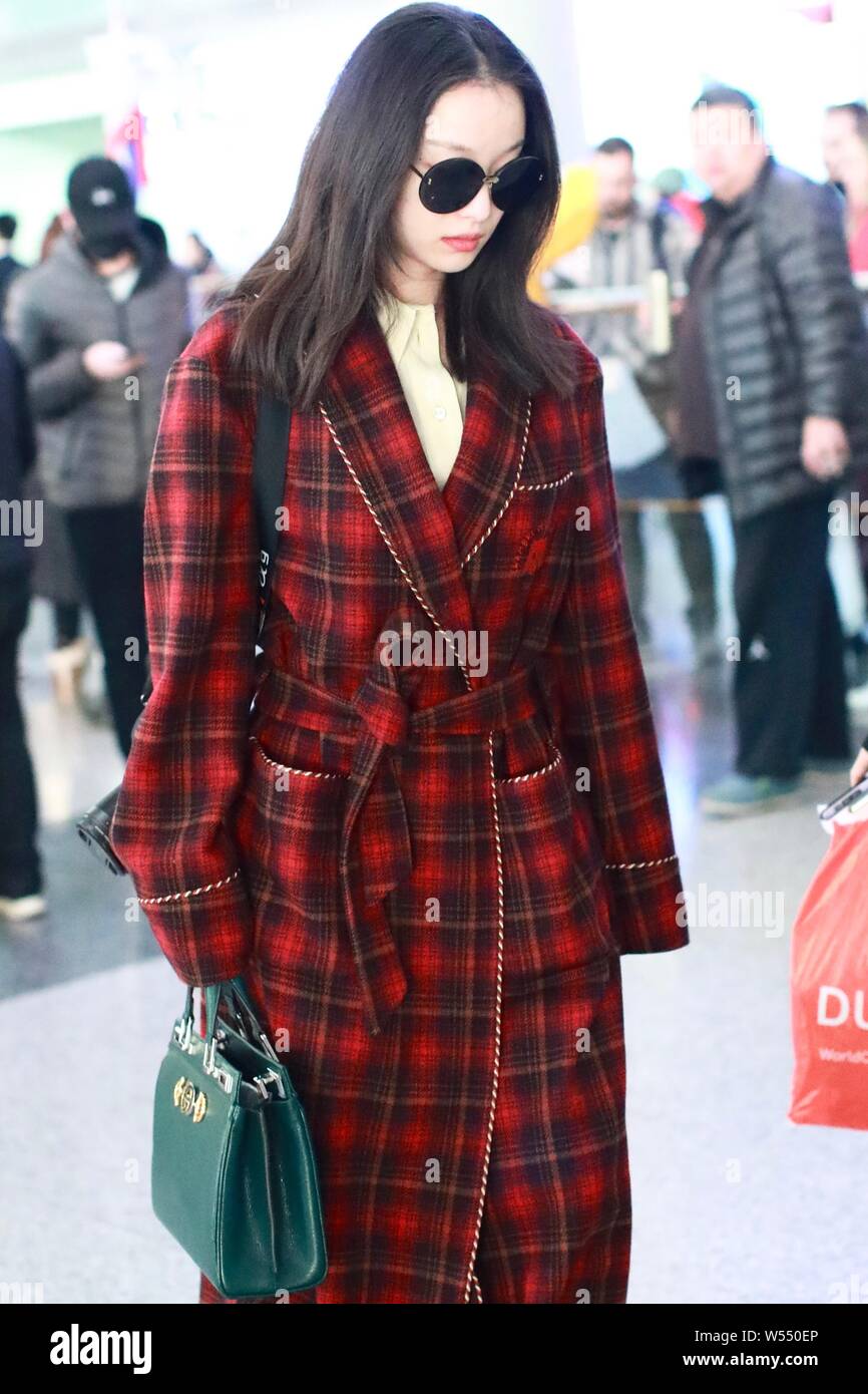 Chinese actress Ni Ni arrives at the Beijing Capital International ...