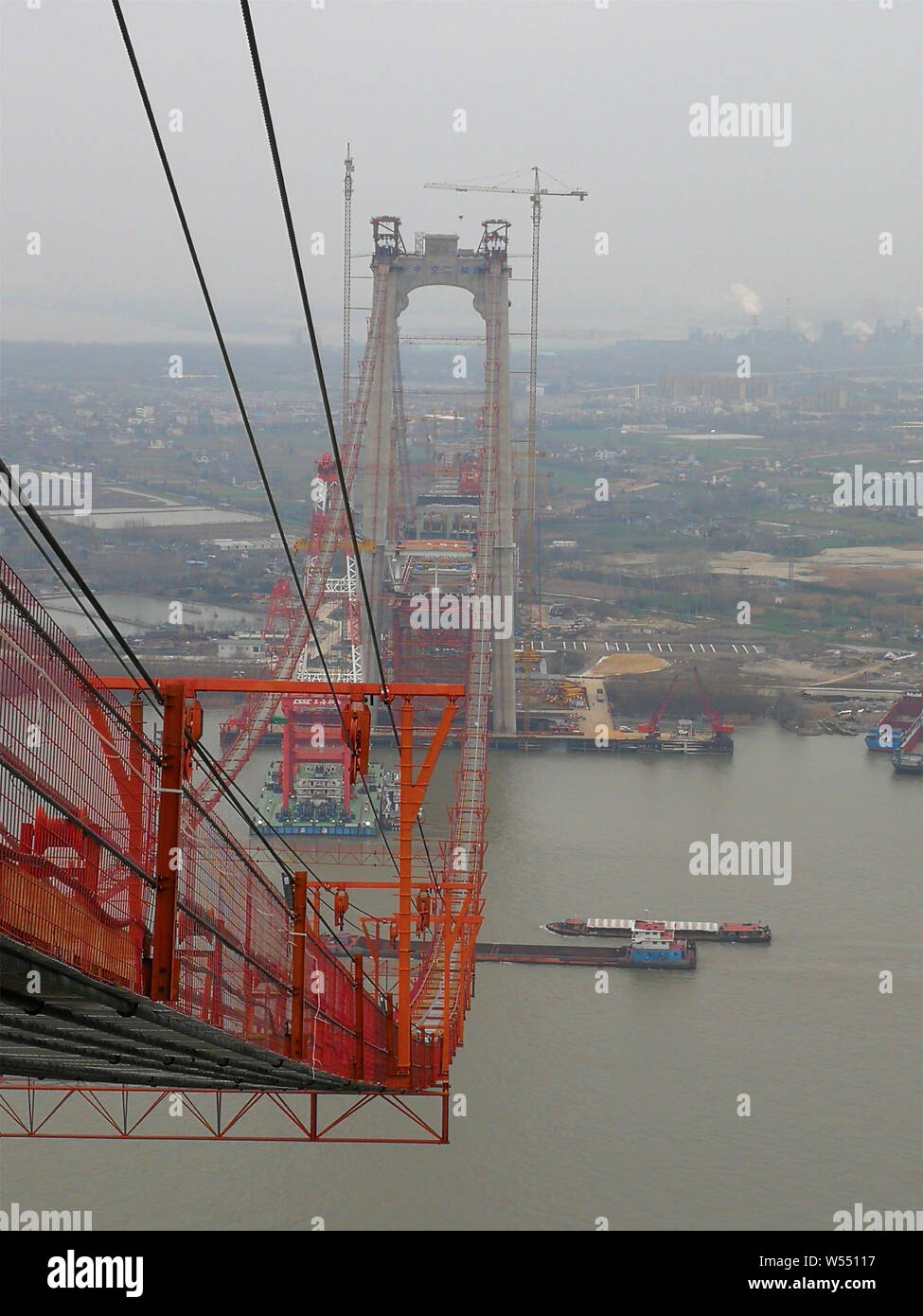 Chinese workers labor at the construction site for Zhenjiang Yangtze ...