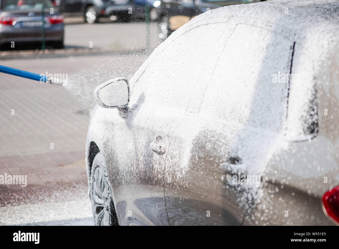 Washing car with soap. Close up concept. Car in foam. Open auto-washing ...