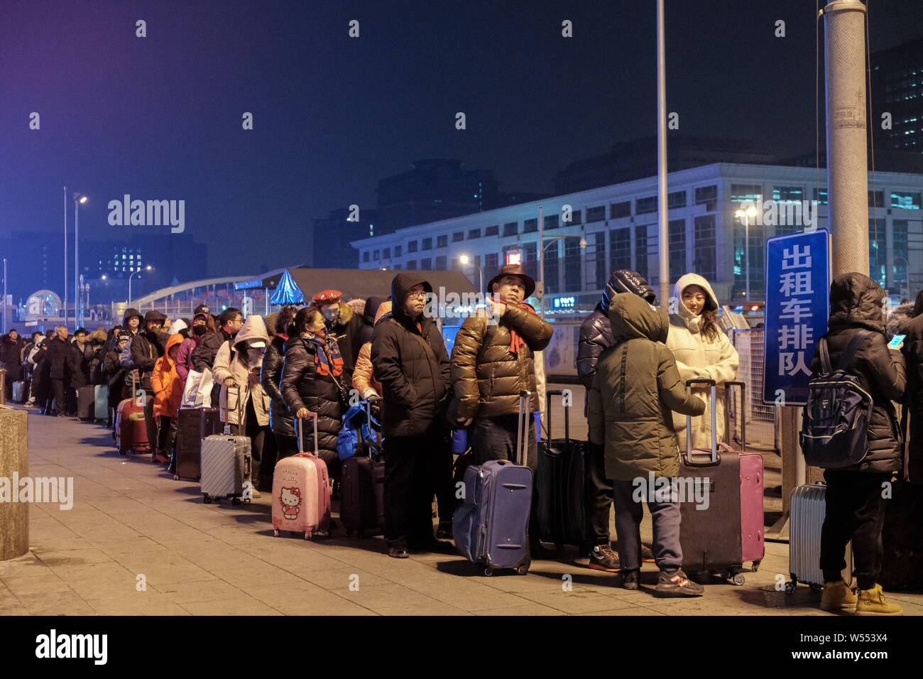 Chinese passengers who return to work from the Chinese Lunar New Year ...