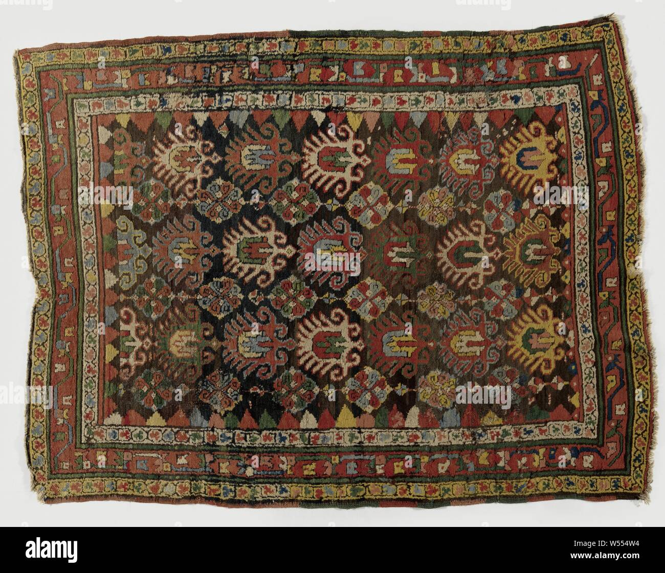Palmette rug with repeating pattern of stylized lotus flowers and ...